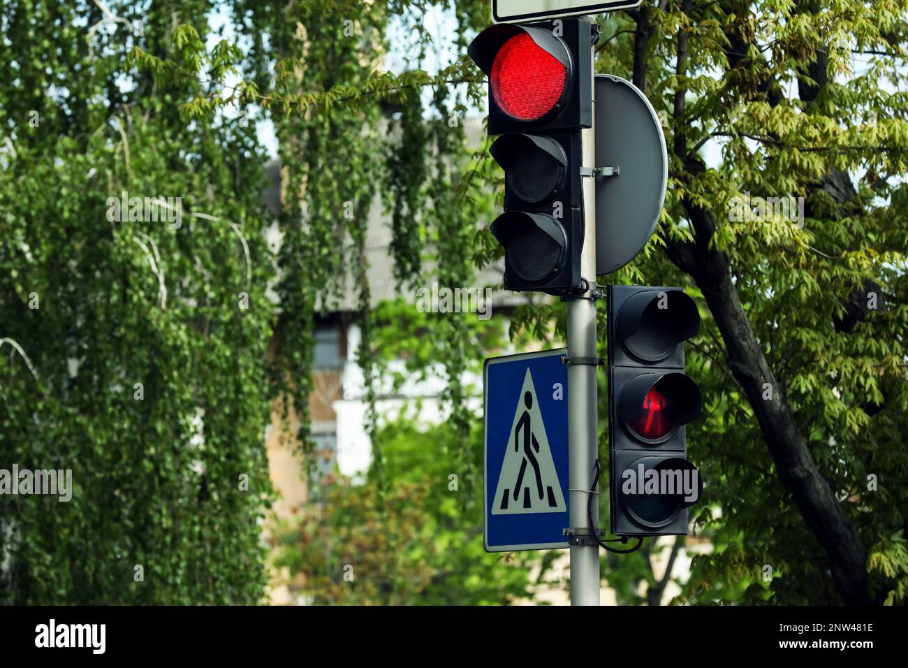 View of modern traffic lights on city street Stock Photo - Alamy