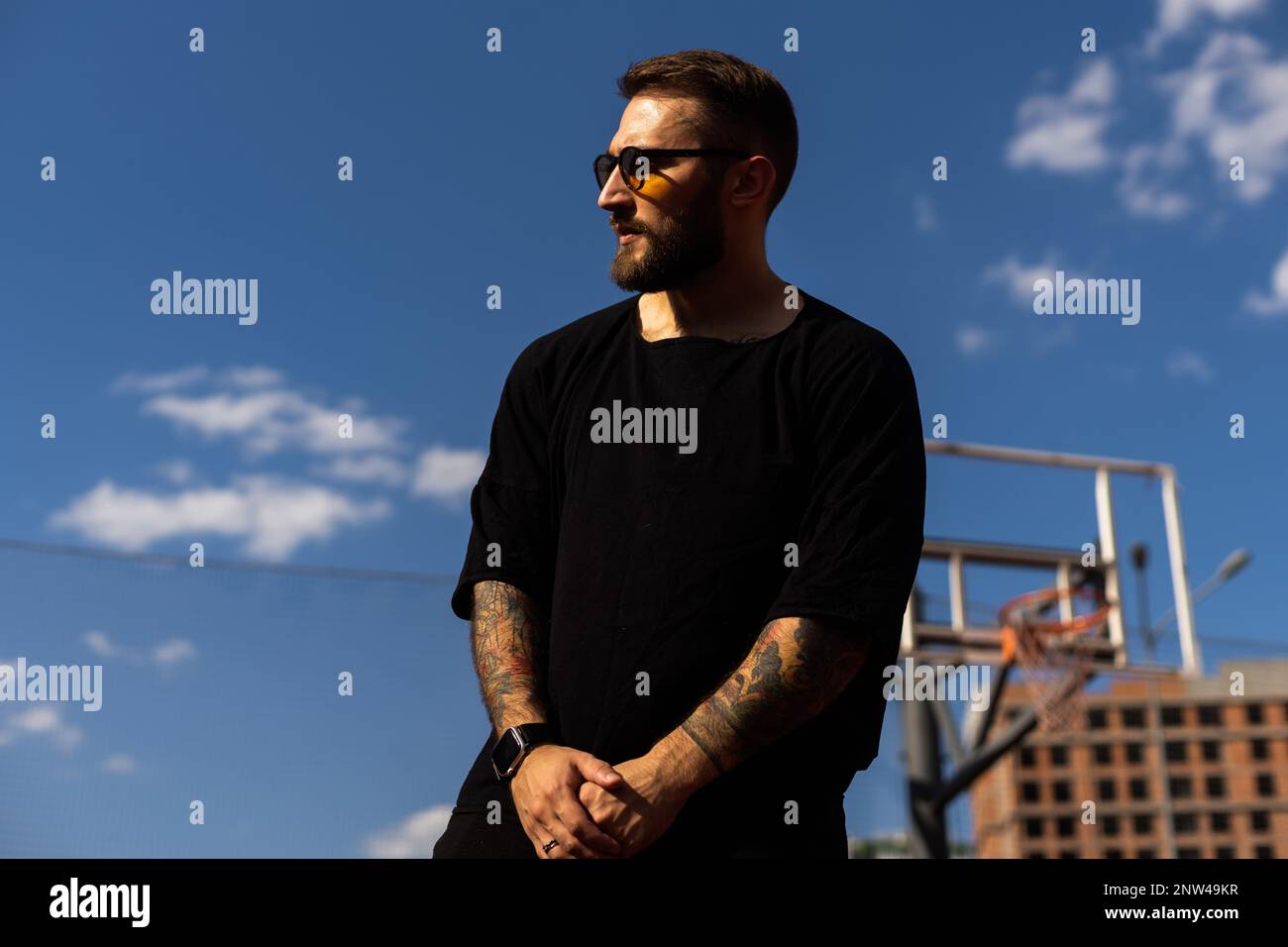 A handsome young man standing outside Stock Photo - Alamy