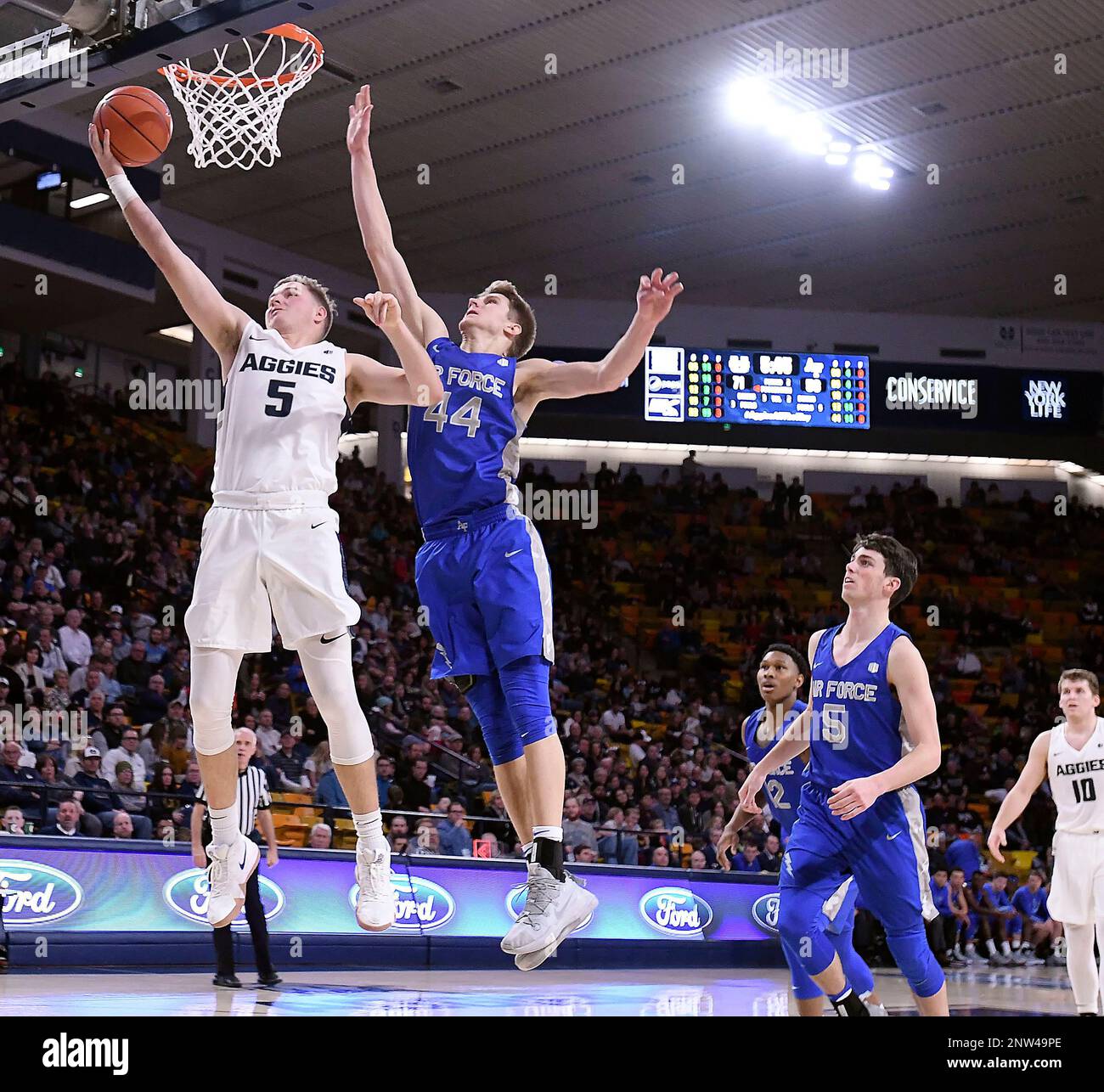 Utah State guard Sam Merrill (5) takes a shot as Air Force guard Keaton ...