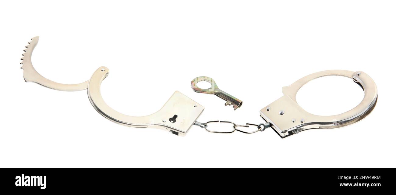 Classic chain handcuffs with key on white background Stock Photo - Alamy