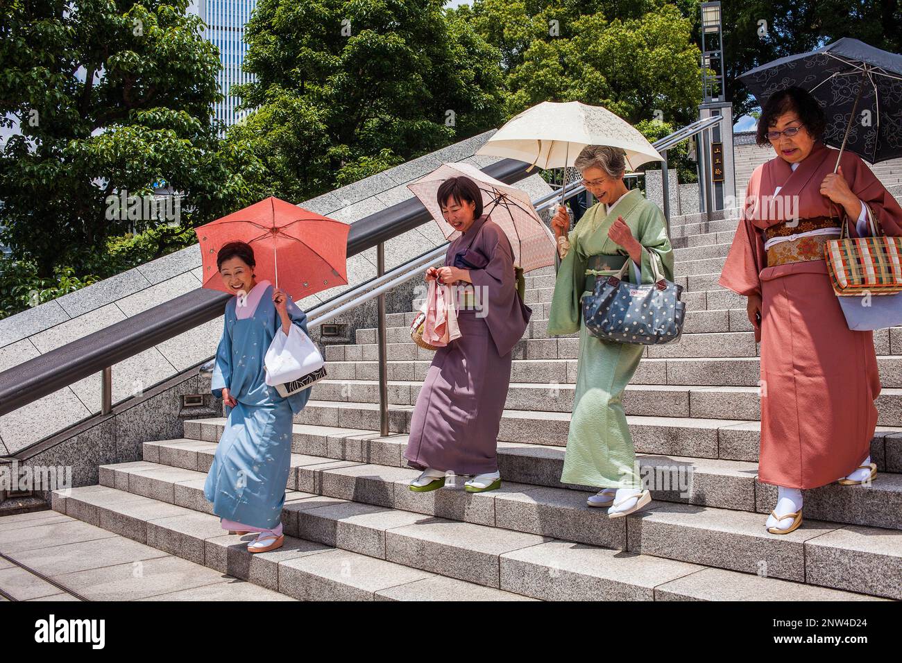 Women at main entrance of HieJinja shrine, Nagata-cho.Tokyo city, Japan ...