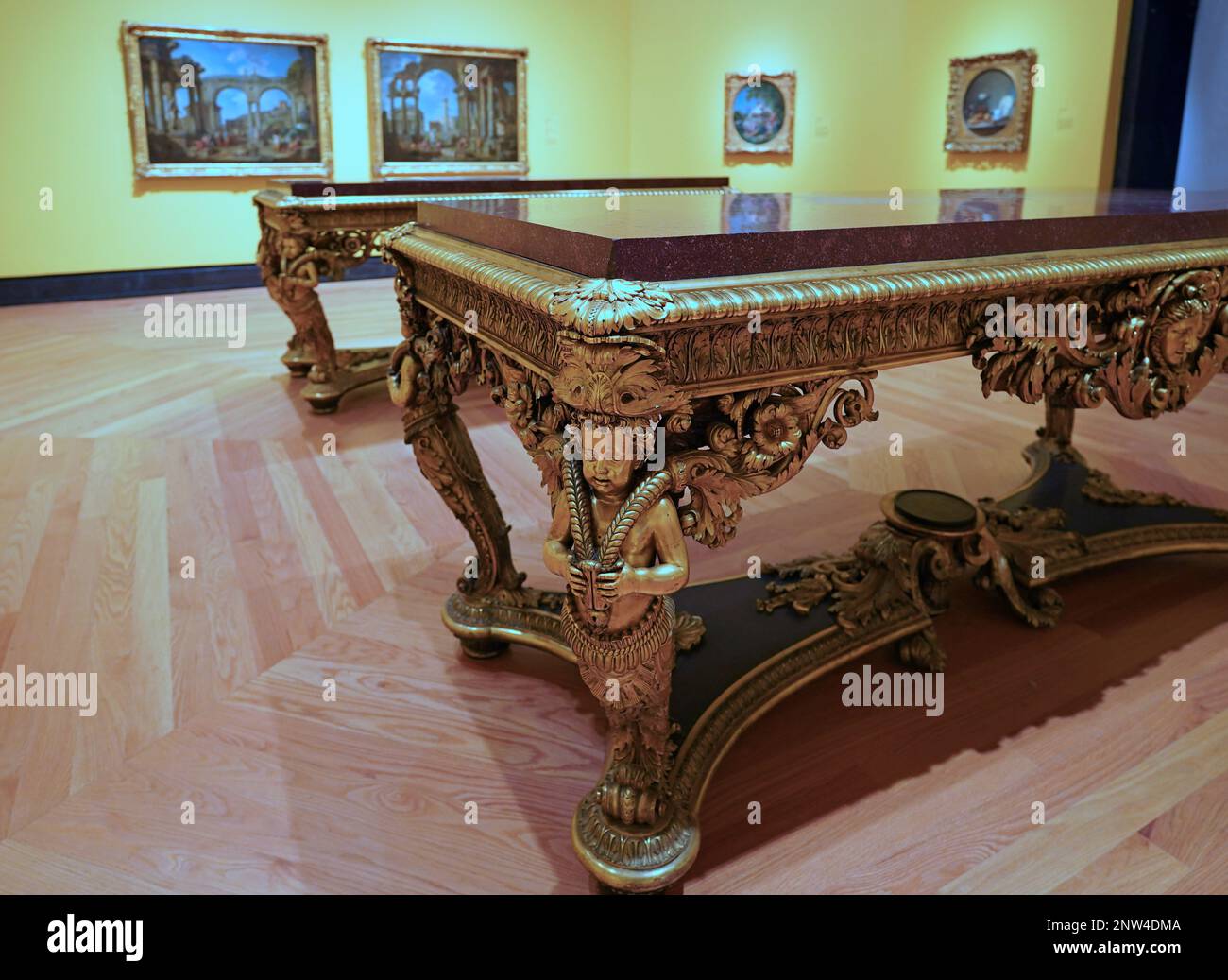 Room with ornate bronze and marble baroque style tables at the Art ...