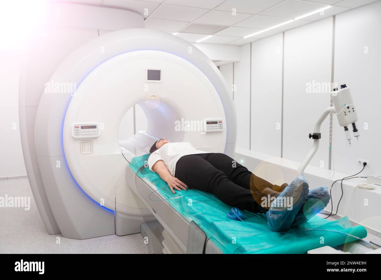 Female patient undergoing MRI - Magnetic resonance imaging in Hospital ...