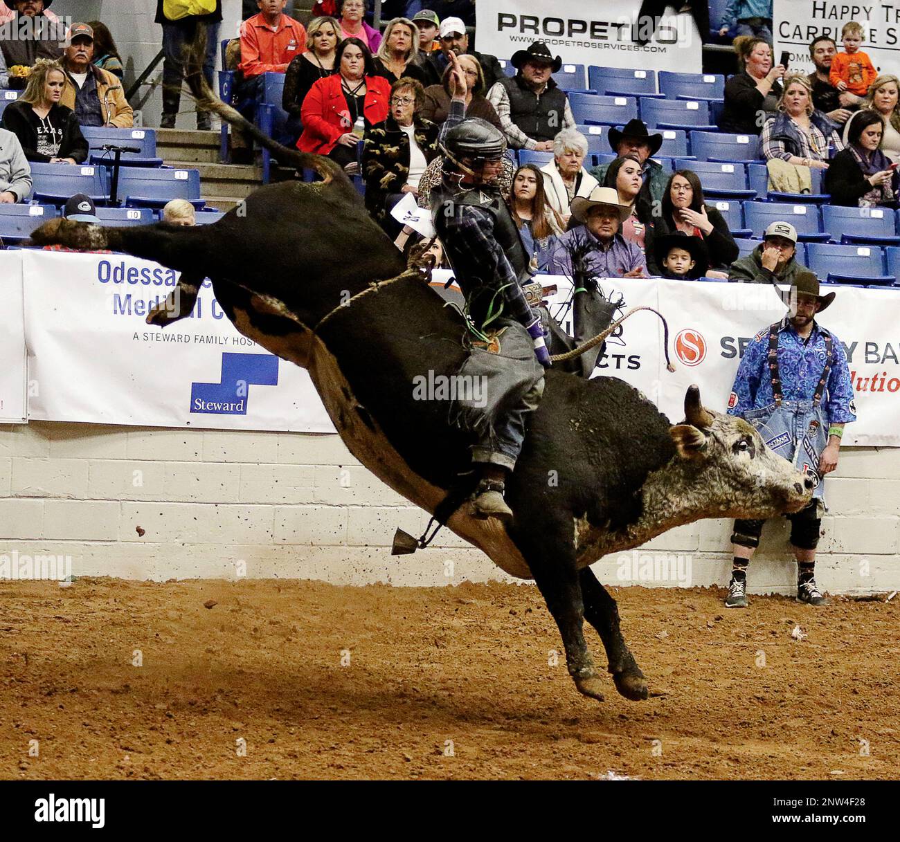 Gunner Conklin competes in bull riding during the Sandhills Stock Show ...