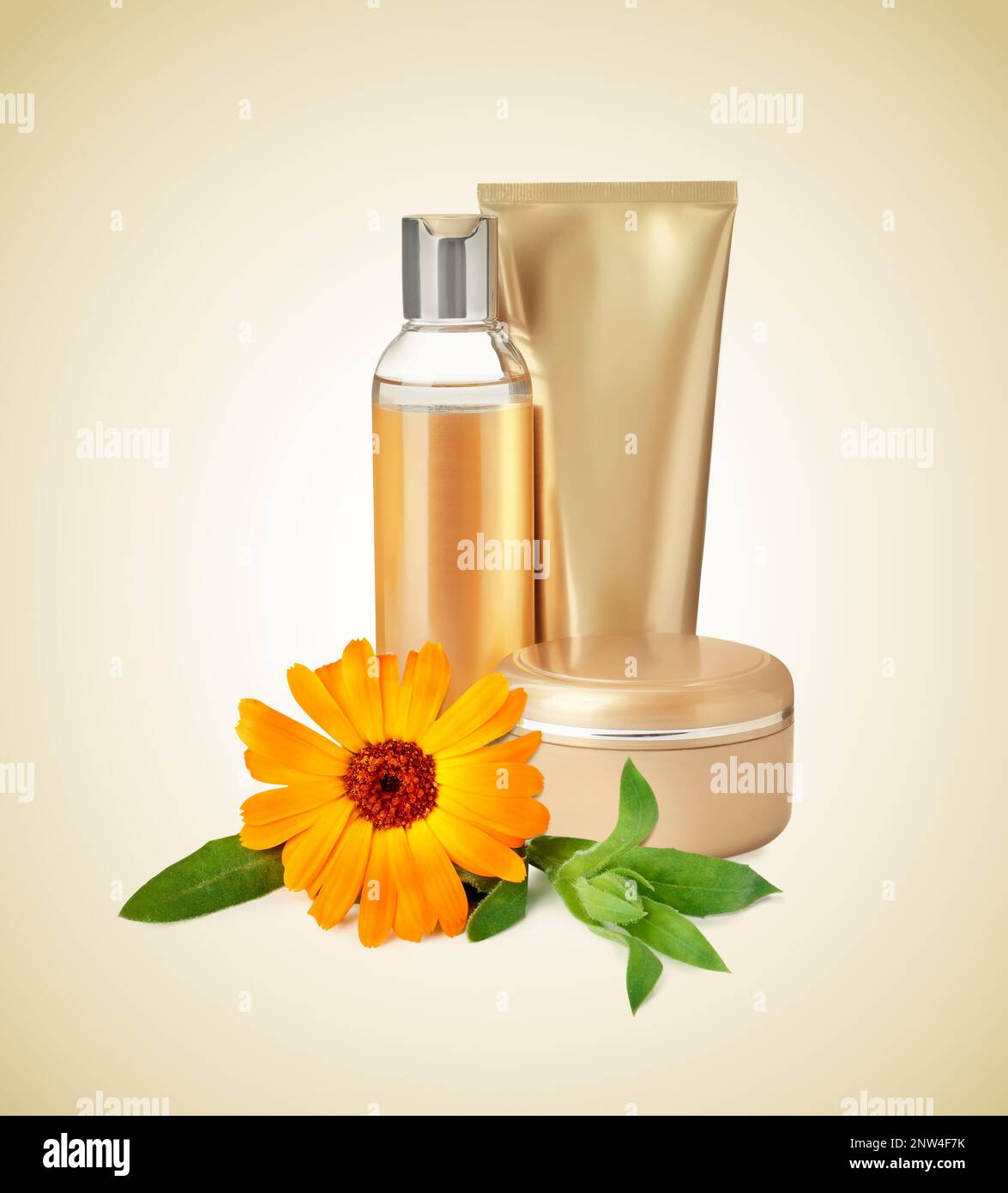 Different cosmetic products with calendula extract on beige background ...