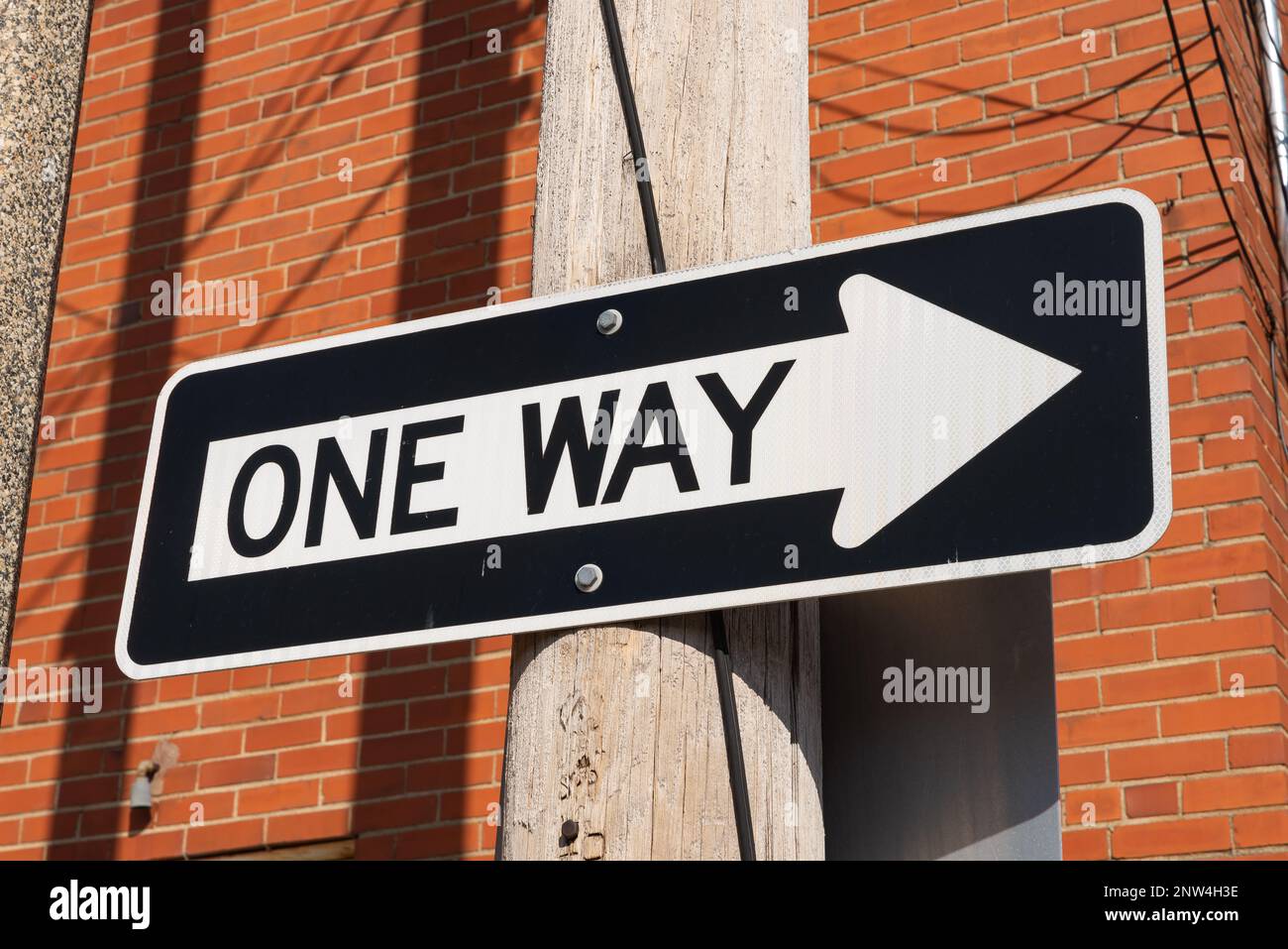 One Way sign in back alley Stock Photo - Alamy
