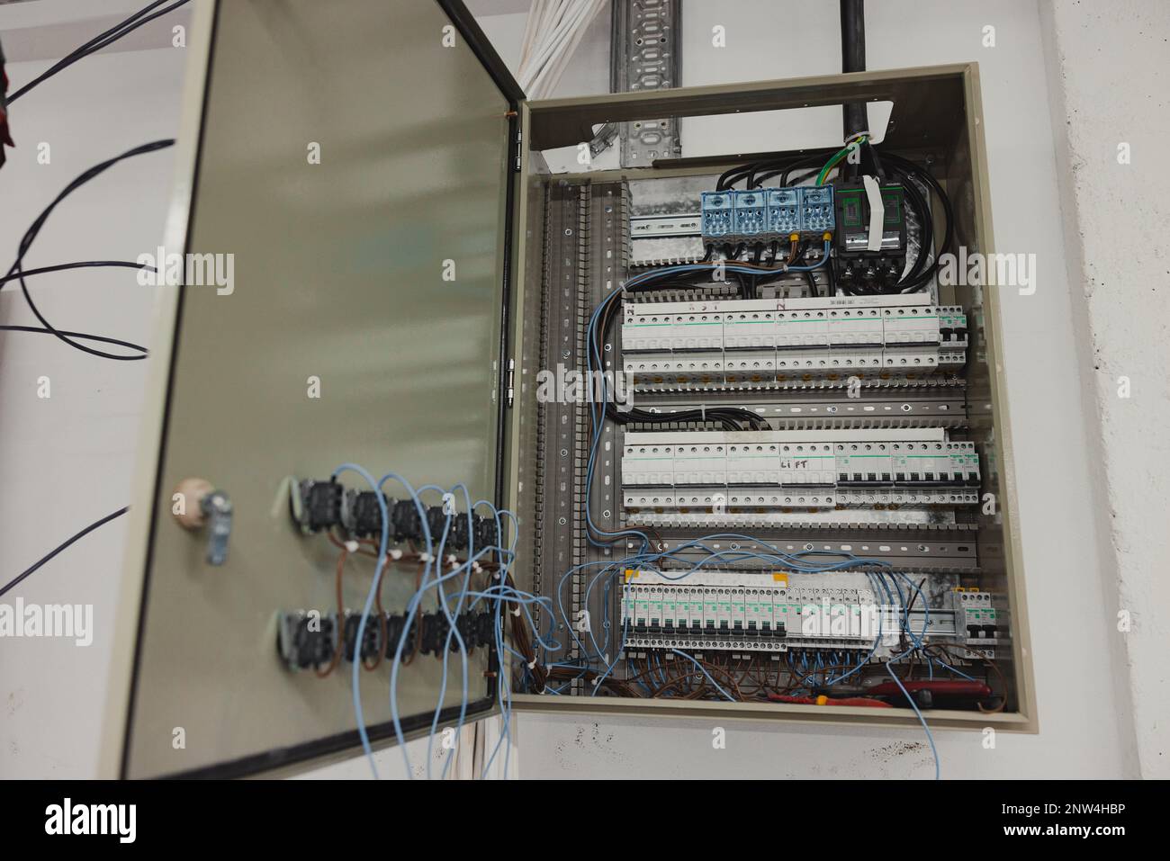 Electrical panel with wires and switches in a modern electrical ...