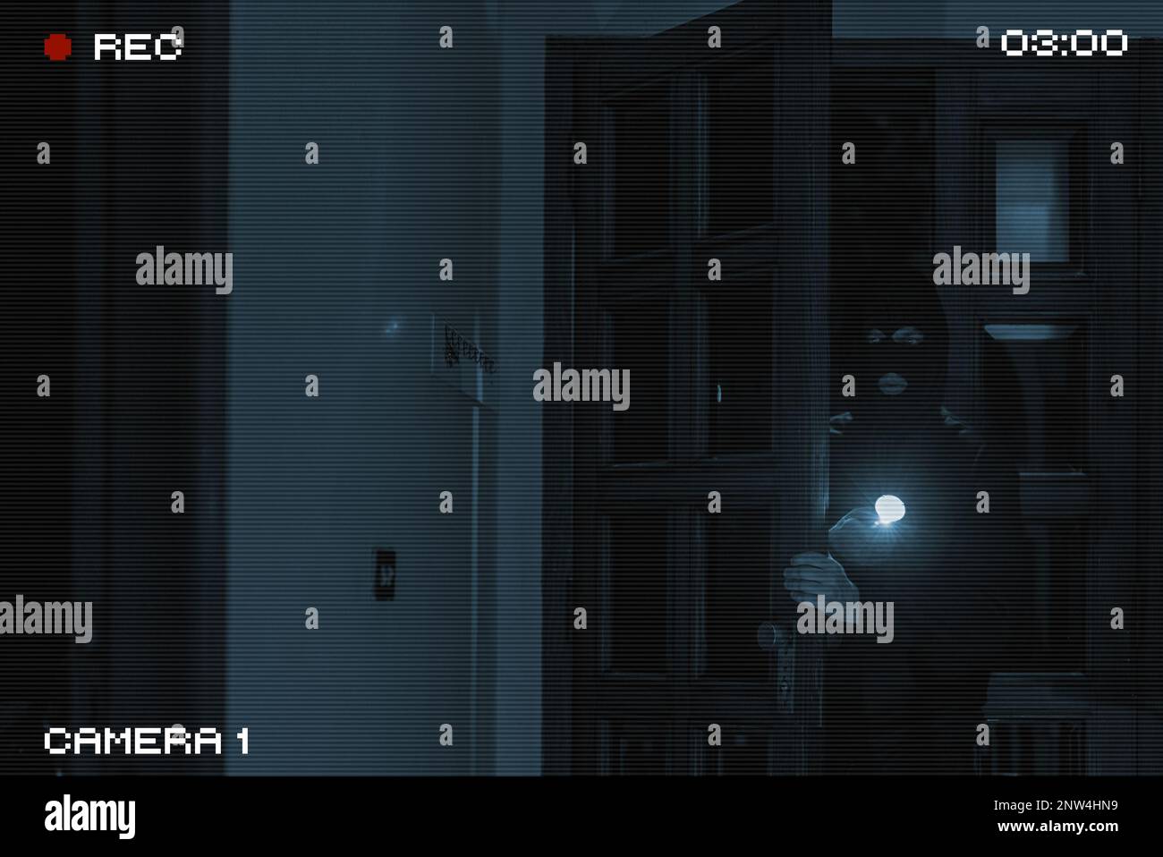 The thief breaks into the house. View through a security camera Stock ...