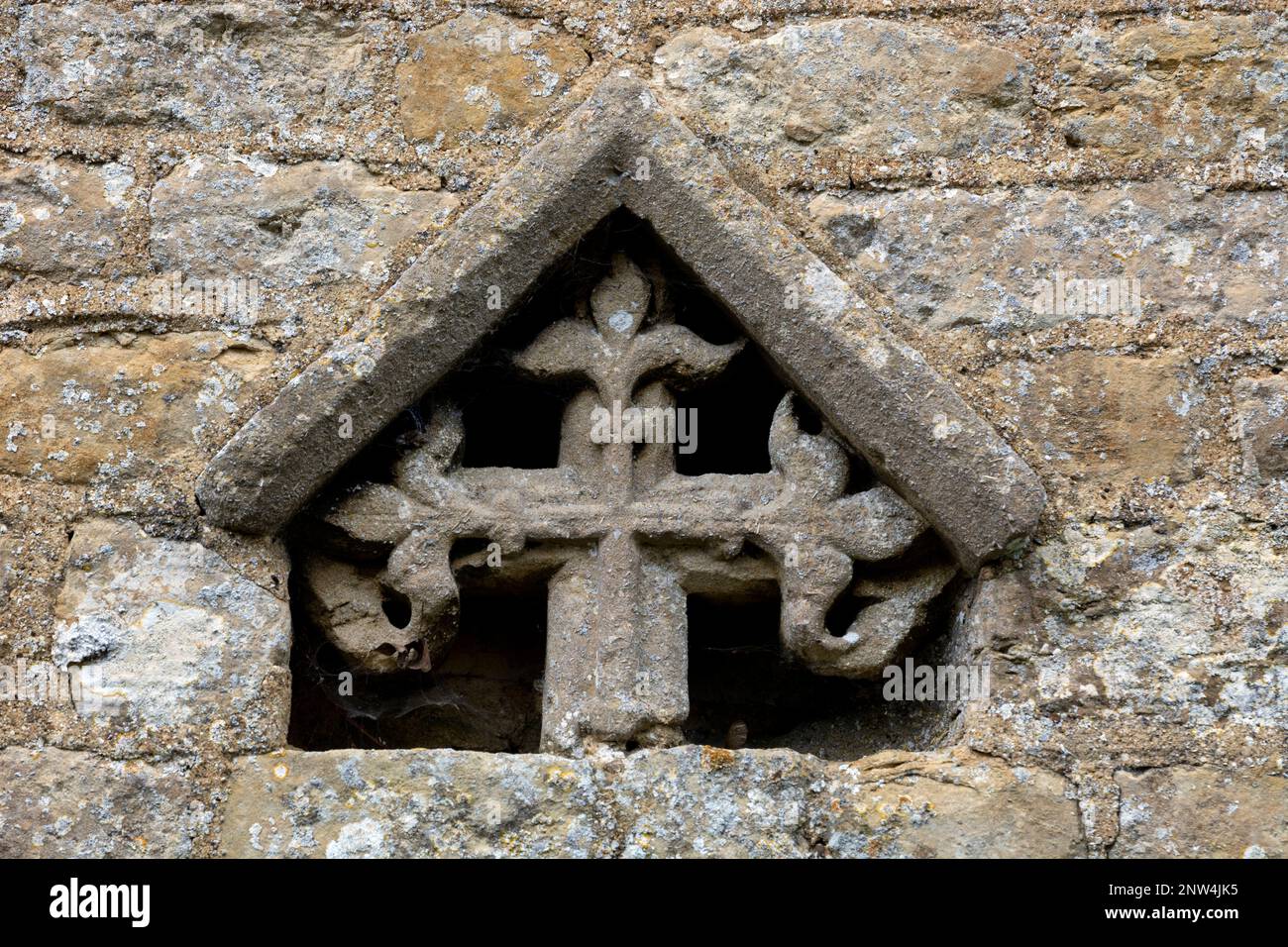 A cross in a niche on St. John the Baptist Church, Tiffield ...