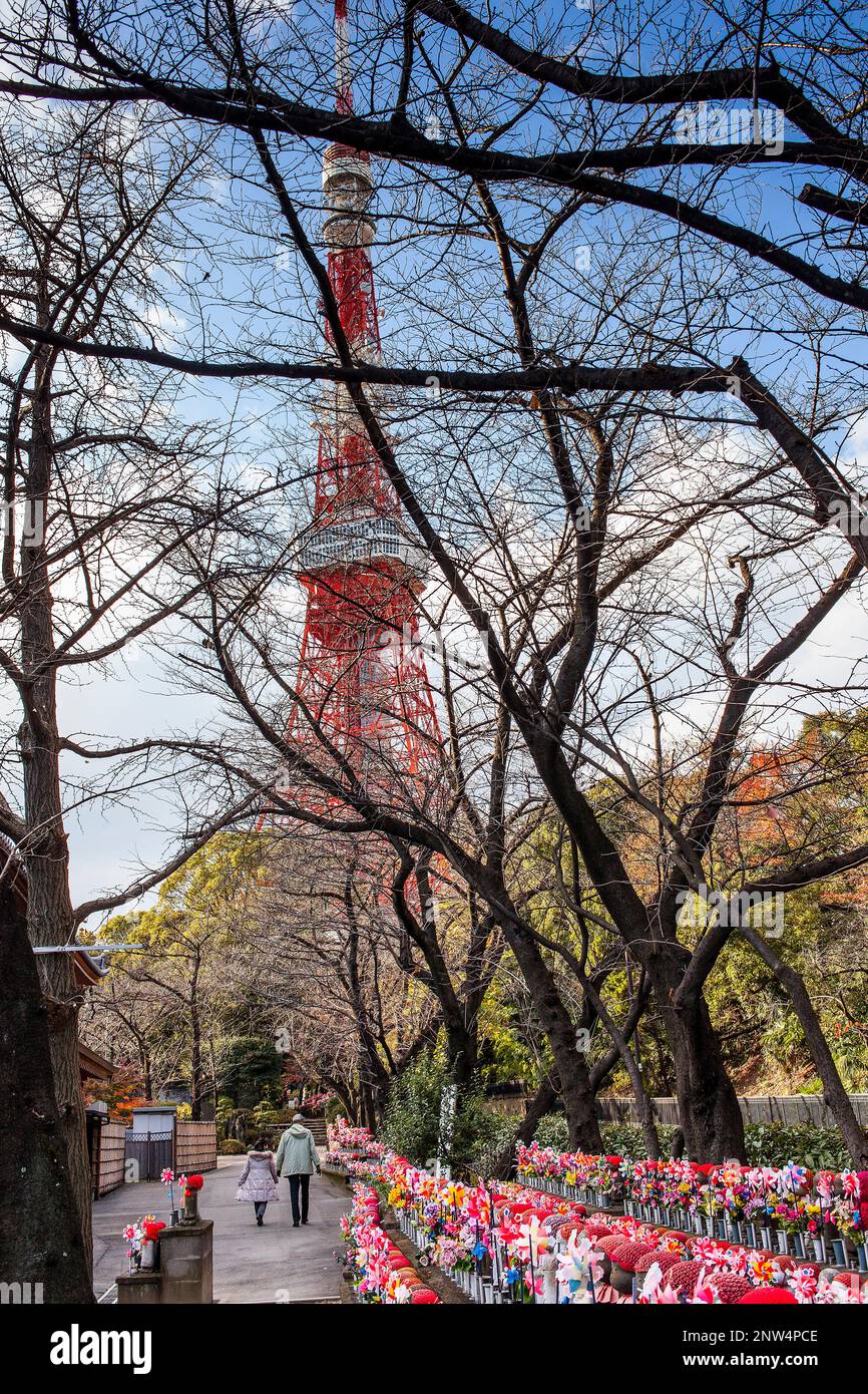 Temple area dedicated to dead unborn children, in Zojoji temple. In background Tokyo tower ...