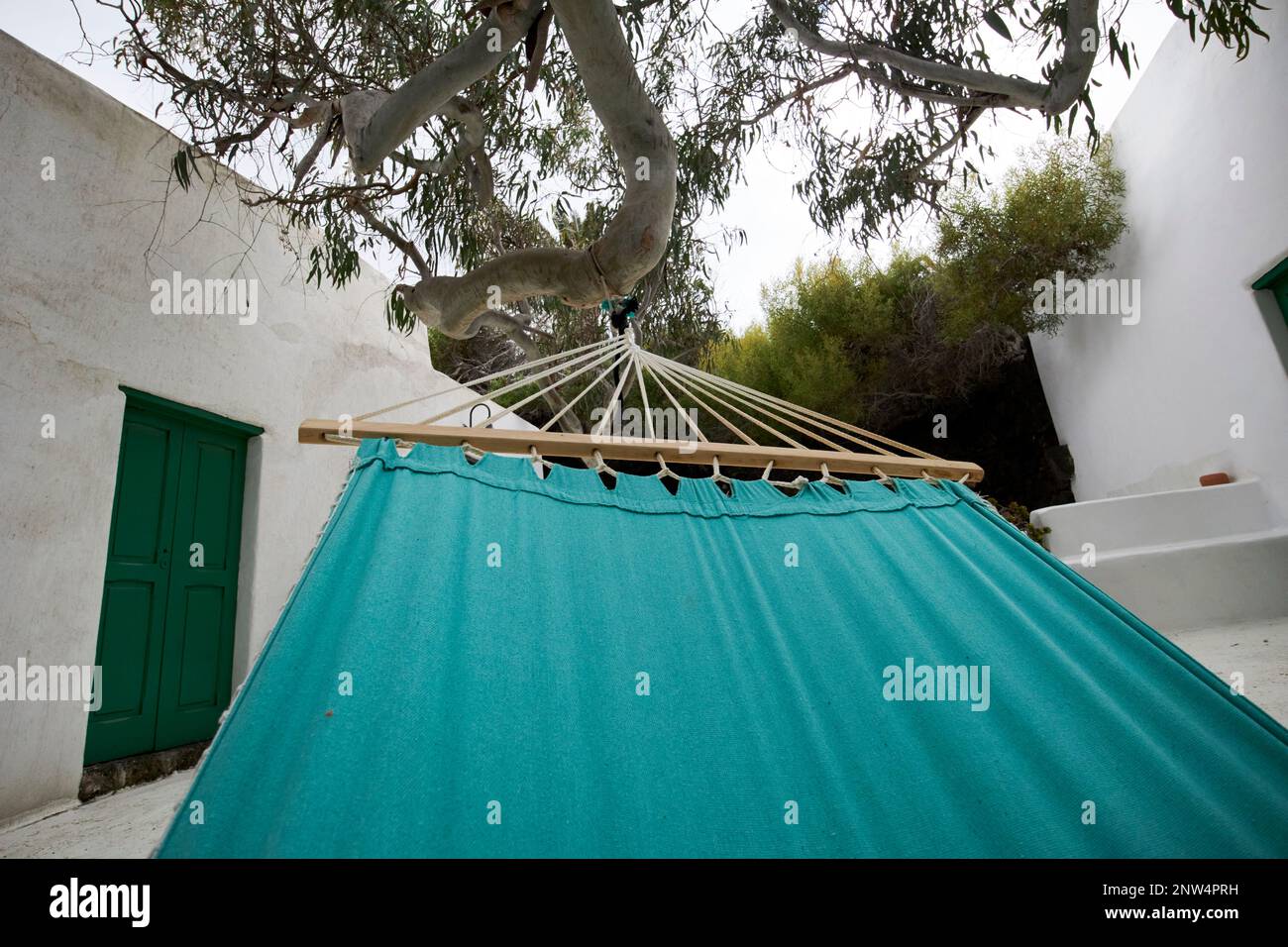 hammock hanging in the courtyard of traditional finca farmhouse ...
