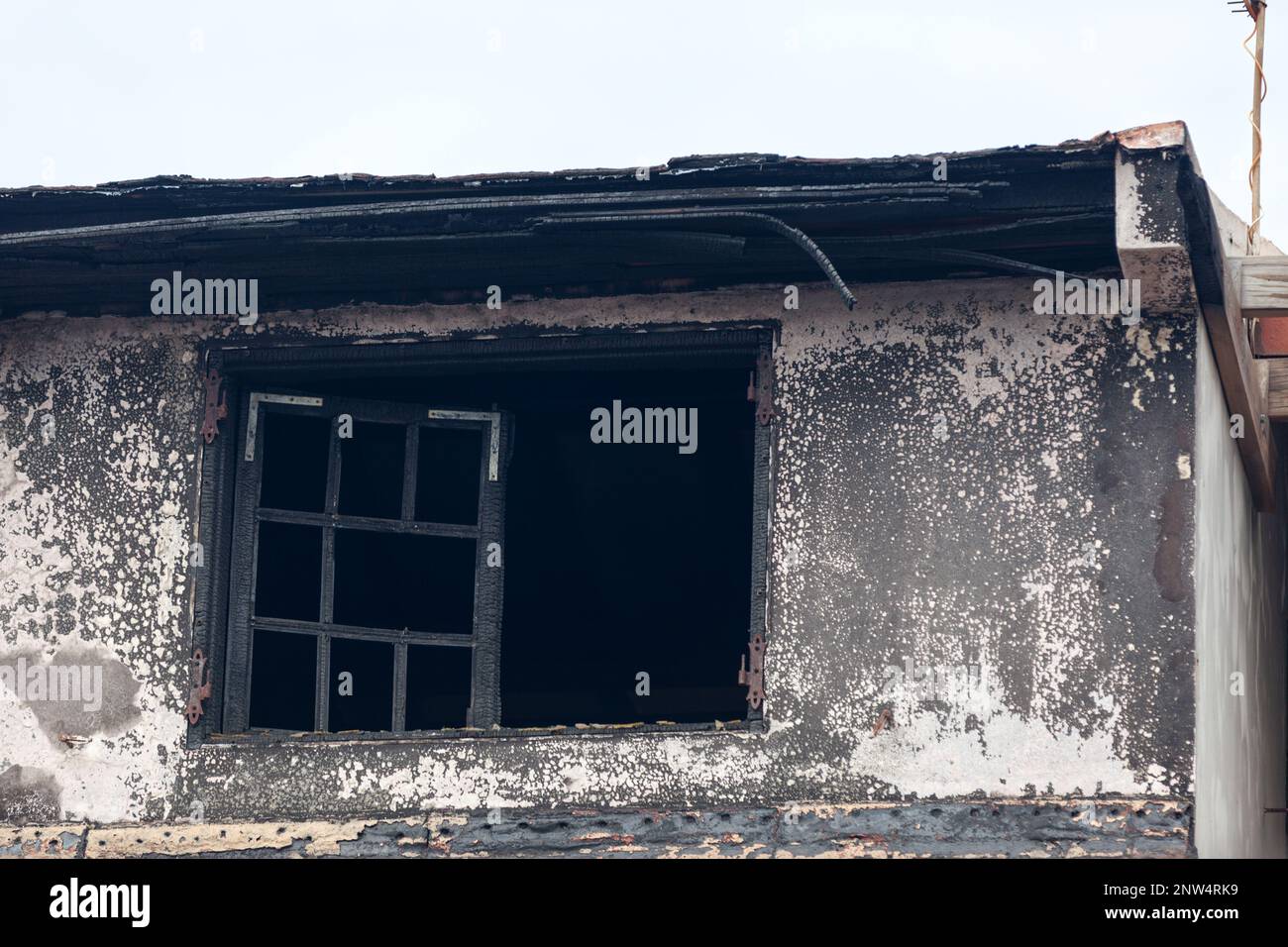 Close-up on the window of a building burnt to the ground Stock Photo ...