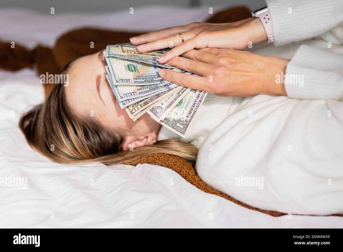 Young caucasian woman holding hands cash money dollars bills. Person ...