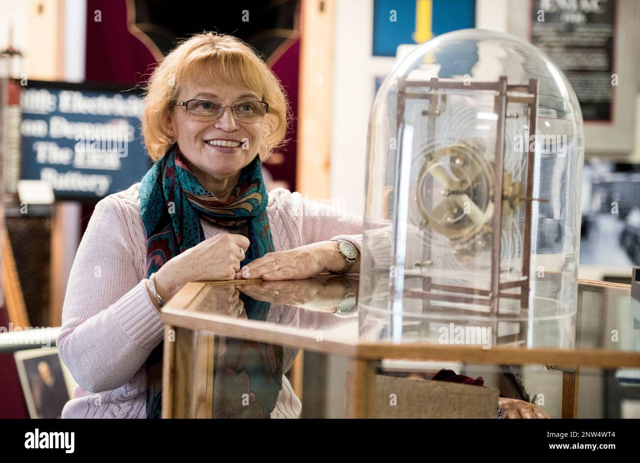 Barbara Keremedjiev poses for a photo next to a reproduction of an ...