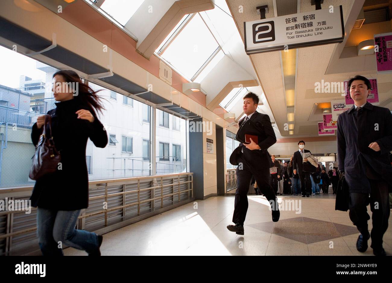 Subway.Meidaimae station. Keio Line. People runing away to get the next ...
