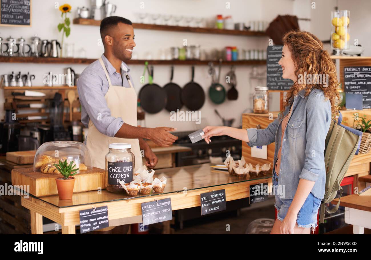 The coolest cafe in town. Shot of two people in a cafe Stock Photo - Alamy