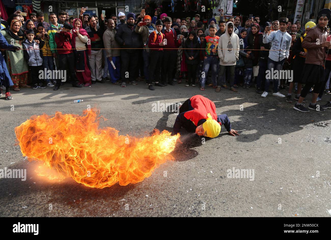 An Indian Sikh warrior blows fire as he displays traditional martial ...
