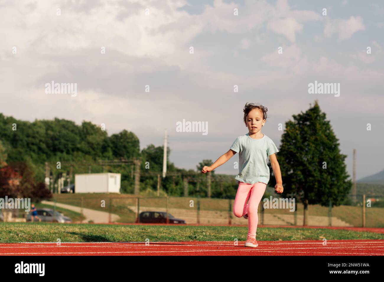 Preschool girl running hi-res stock photography and images - Alamy