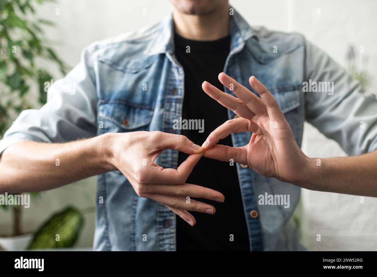 Sign language interpreter man translating a meeting to ASL, American ...