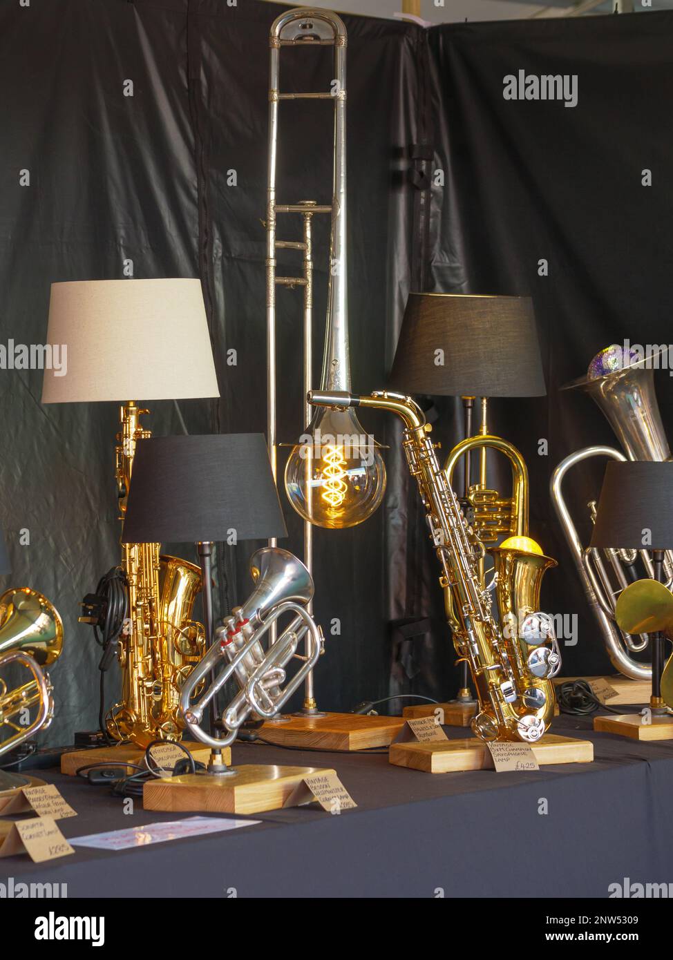 A collection of musical intruments repurposed as light stands at the ...