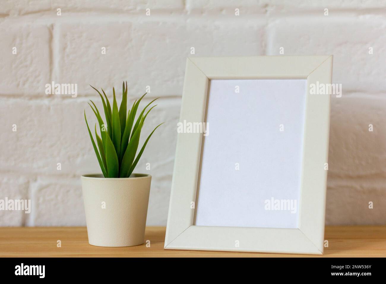 An empty photo frame on a table or shelf with a copy of the space Stock ...