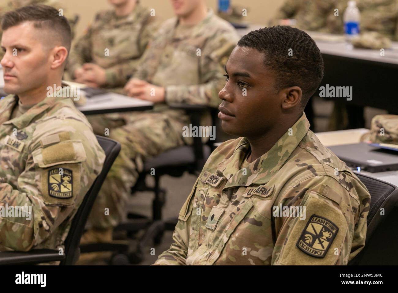 Cadets from 5th Brigade Army ROTC listen as Col. Philbert Palmore, 5th ...