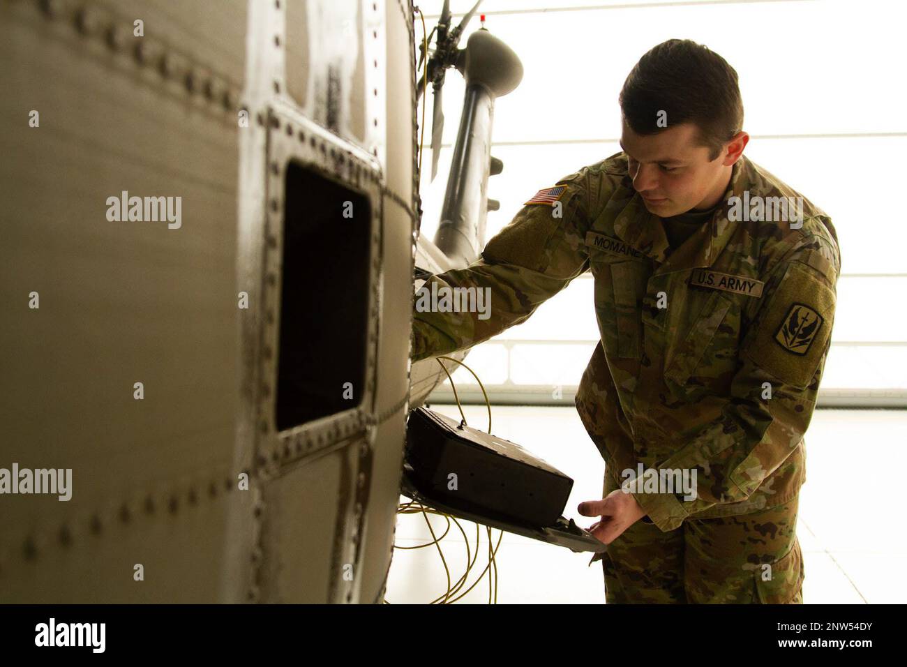 Spc. Timothy Momaney, a newly trained UH-60 helicopter repairer with ...