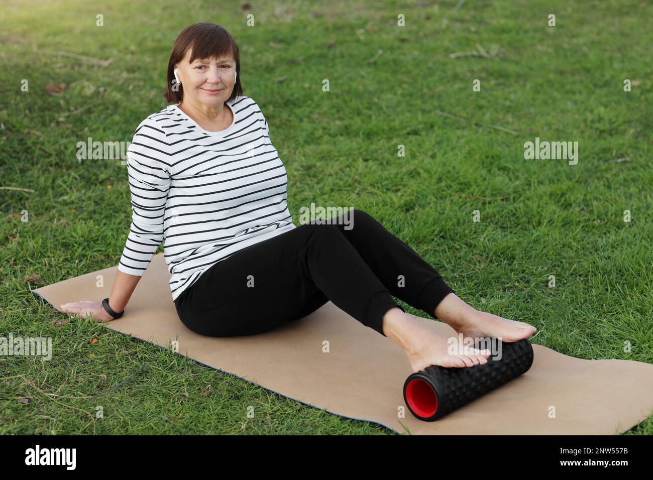 Relaxation after workout. Happy adult sportive woman in casual ...