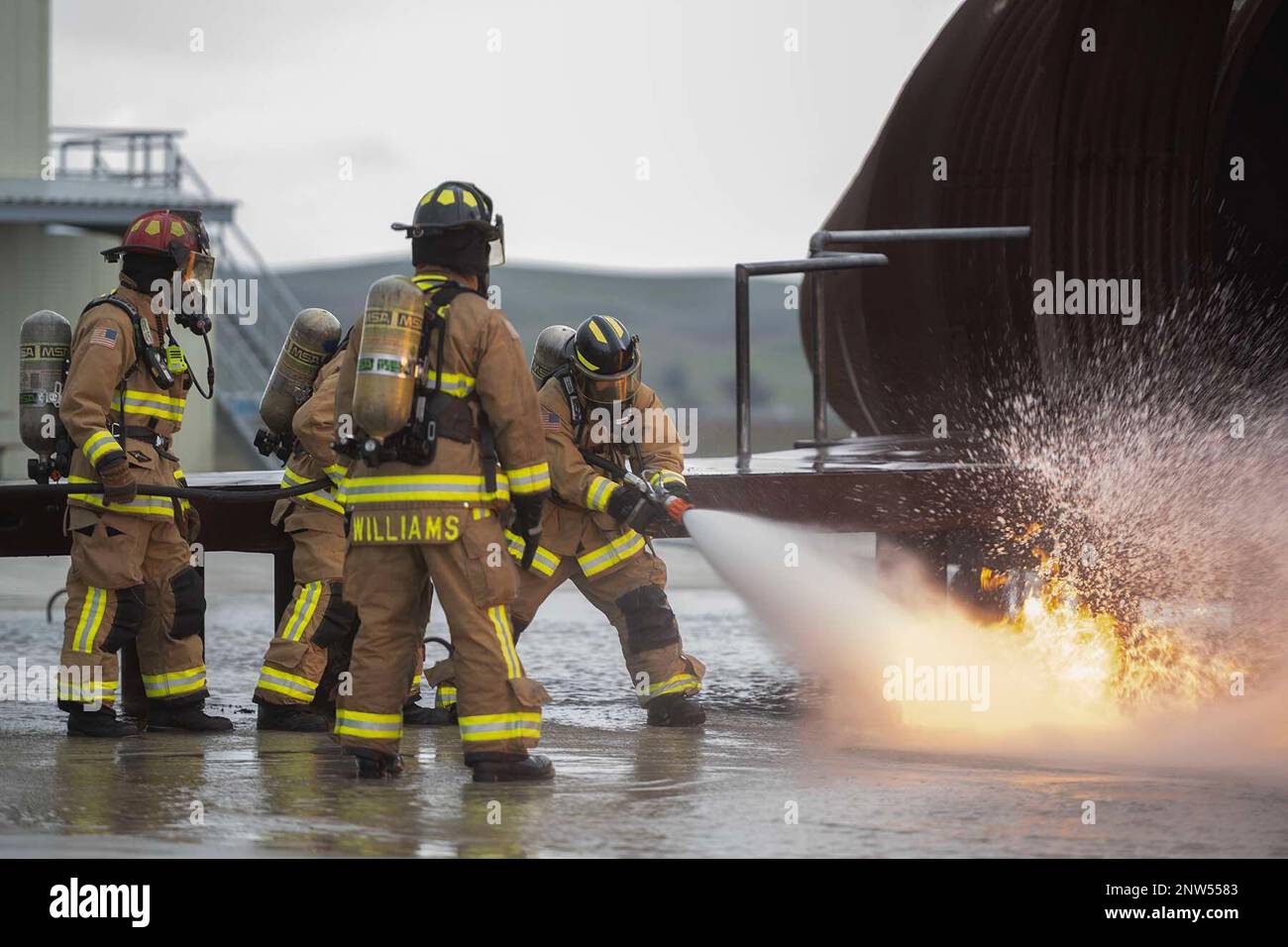 U.S. Air Force Staff Sgt. Montarius Williams, center, 60th Civil ...