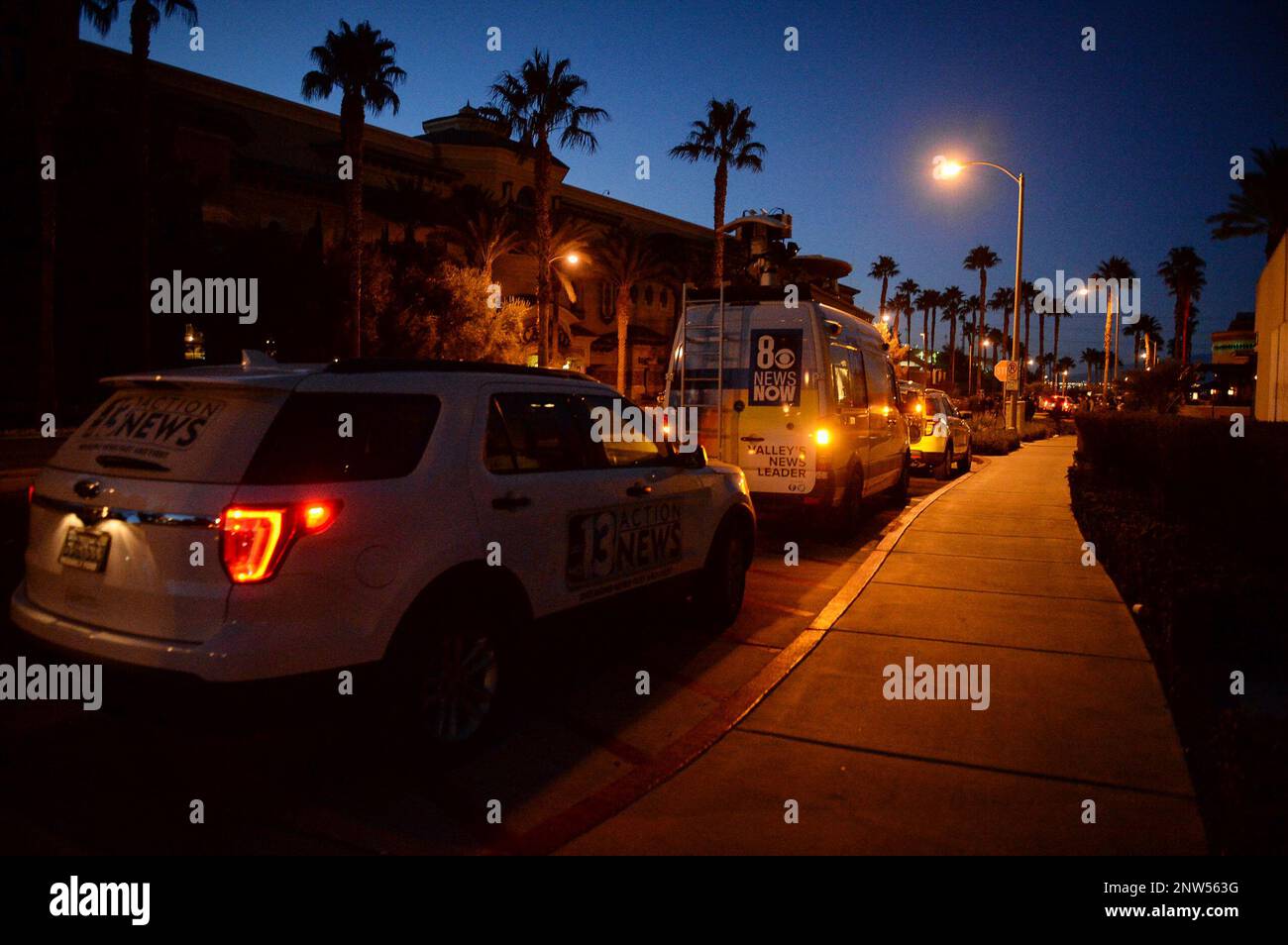 Local news station vans line up after reports of a shooting at Green ...