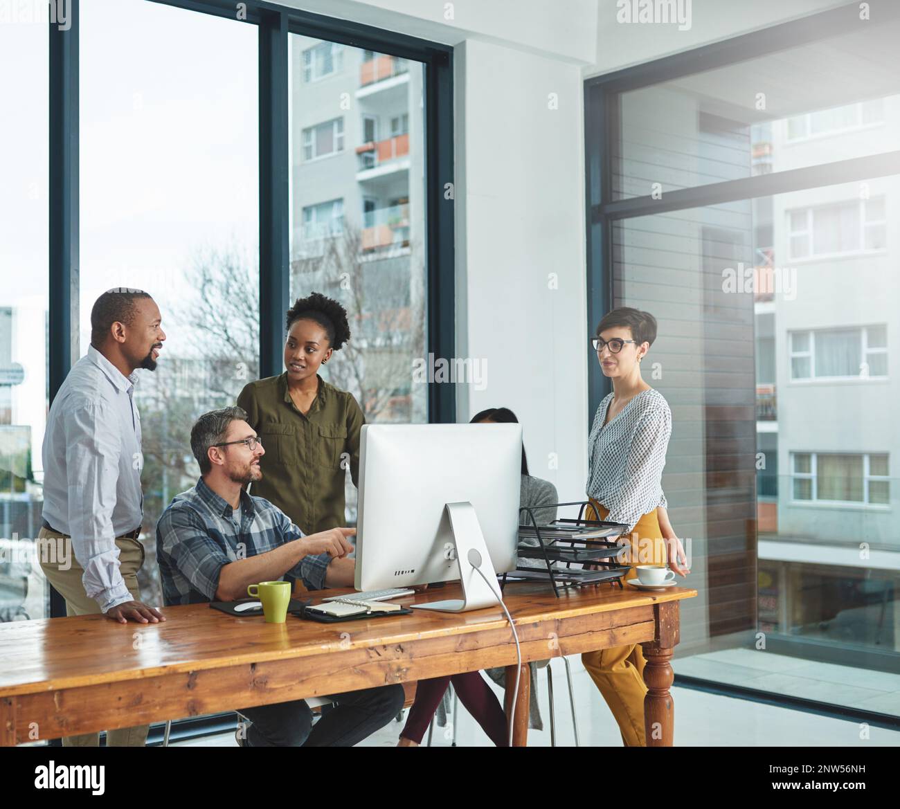 Working together to get the task done. Shot of businesspeople working ...
