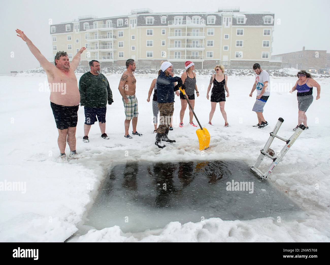 Organizer Cheryl Paynter, centre, directs revellers as they brave ...