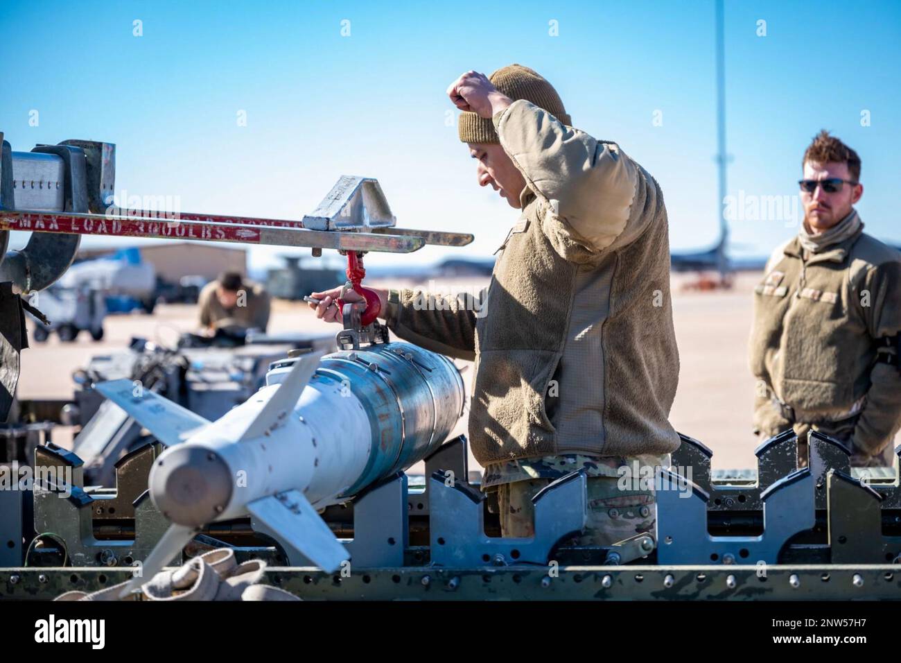 A load crew member assigned to the 9th Aircraft Maintenance Unit ...