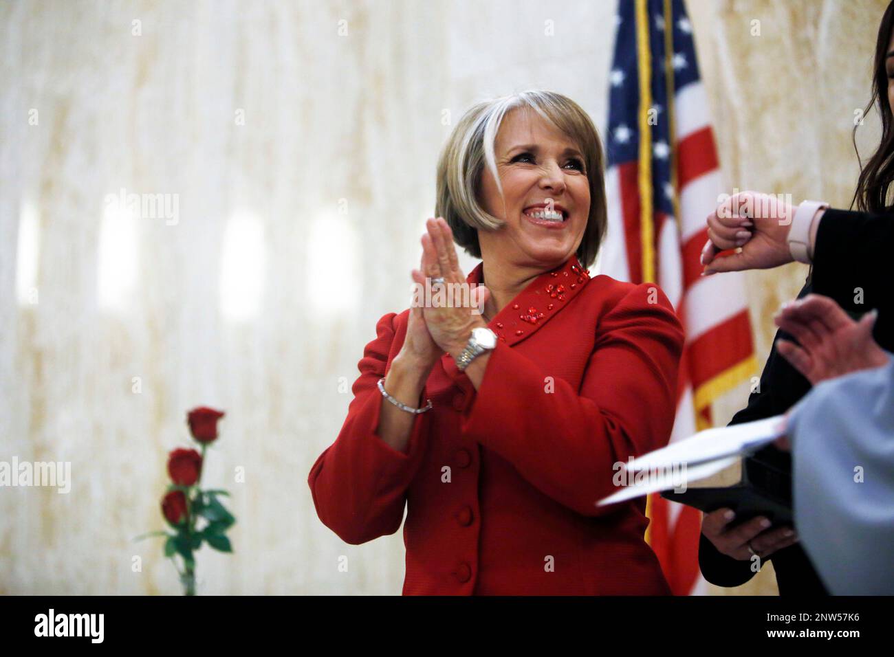 New Mexico Gov. Michelle Lujan Grisham smiles after taking the oath of ...