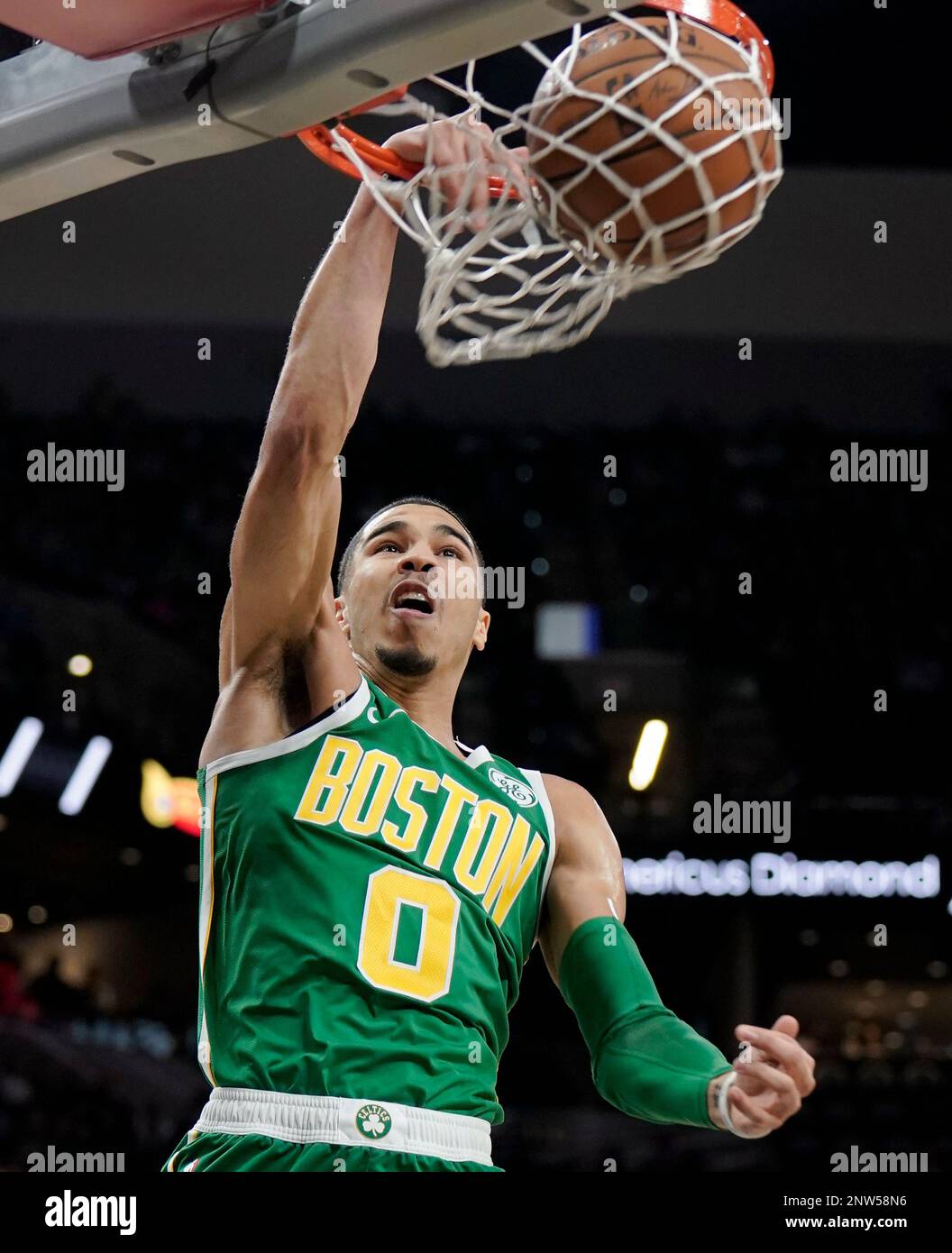 Boston Celtics' Jayson Tatum dunks during the first half of an NBA ...