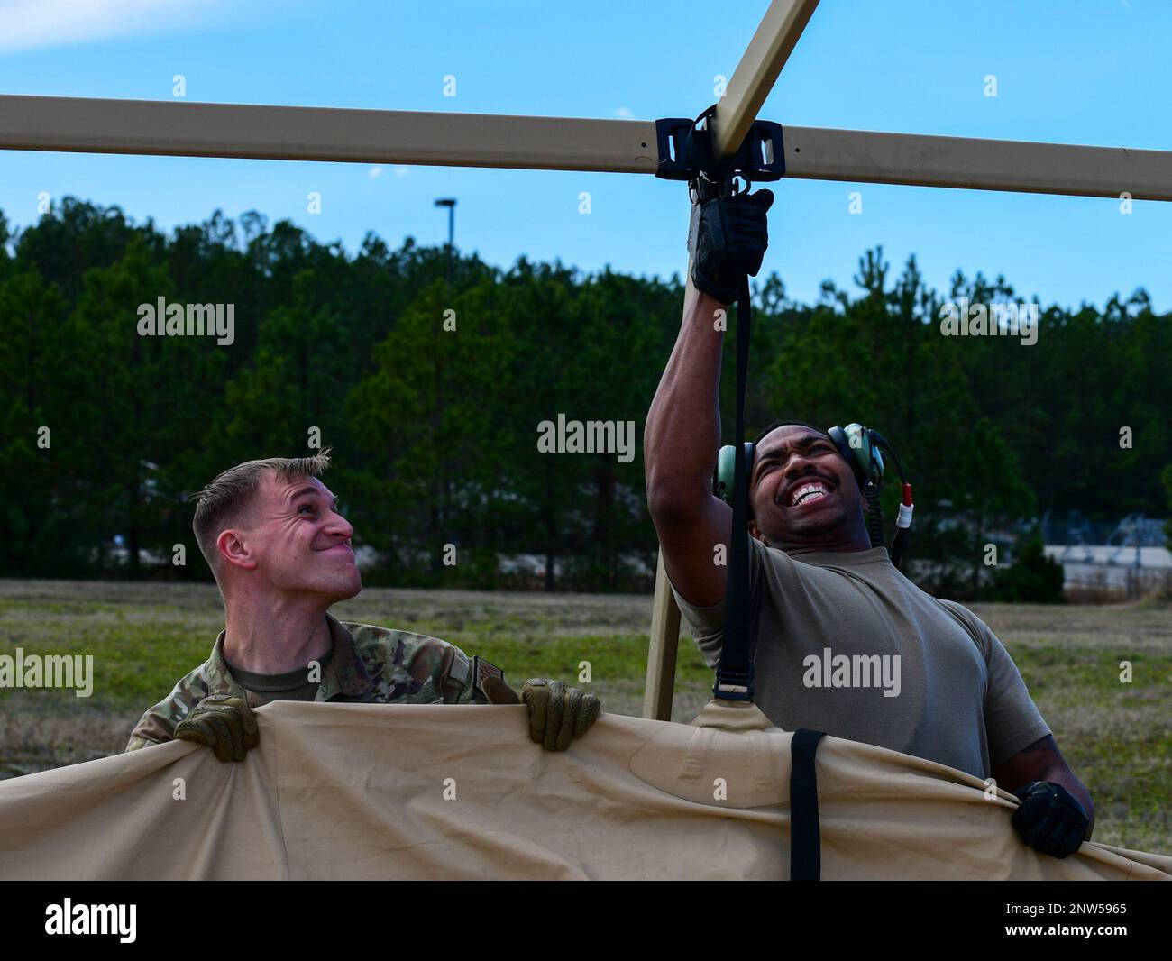 U.S. Airmen with the 628th Civil Engineering Squadron assemble a command and control tent at ...