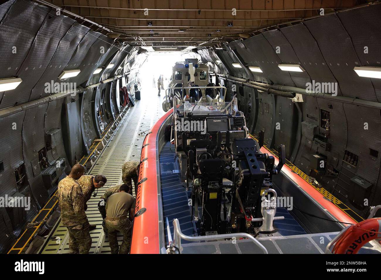 U.S. Airmen with the 22nd Airlift Squadron and U.S. Coast Guardsmen ...