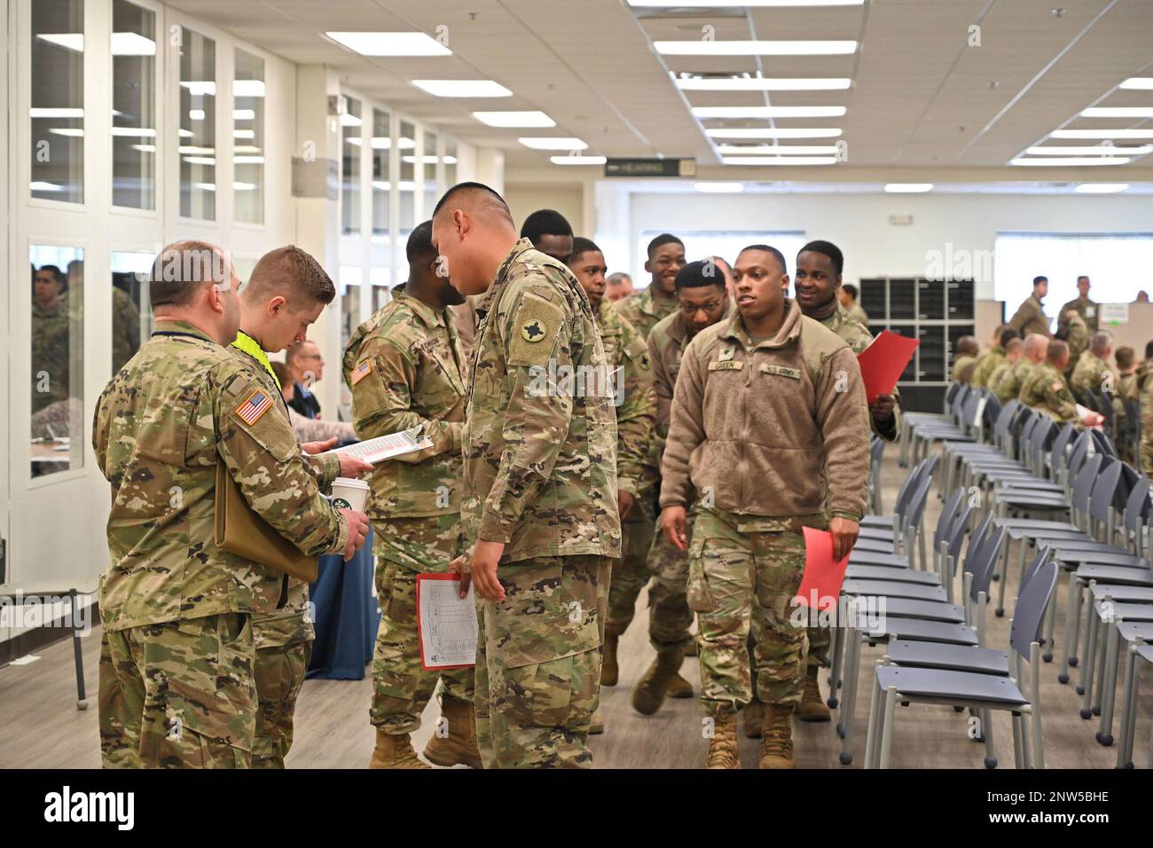 Soldiers are shown processing through the Fort Dix JRC. (Images ...
