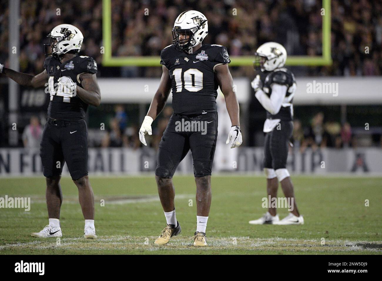 Central Florida defensive lineman Titus Davis (10) sets up for a play ...
