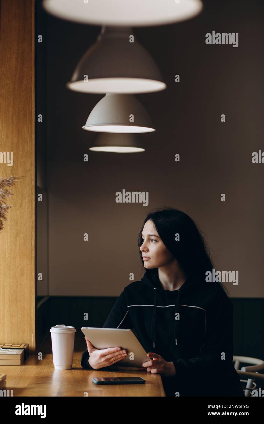 Focused business woman sit on cafe working on laptop, concentrated ...