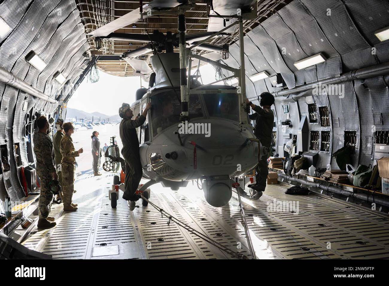 U.S. Airmen assigned to the 22nd Airlift Squadron and U.S. Marines ...