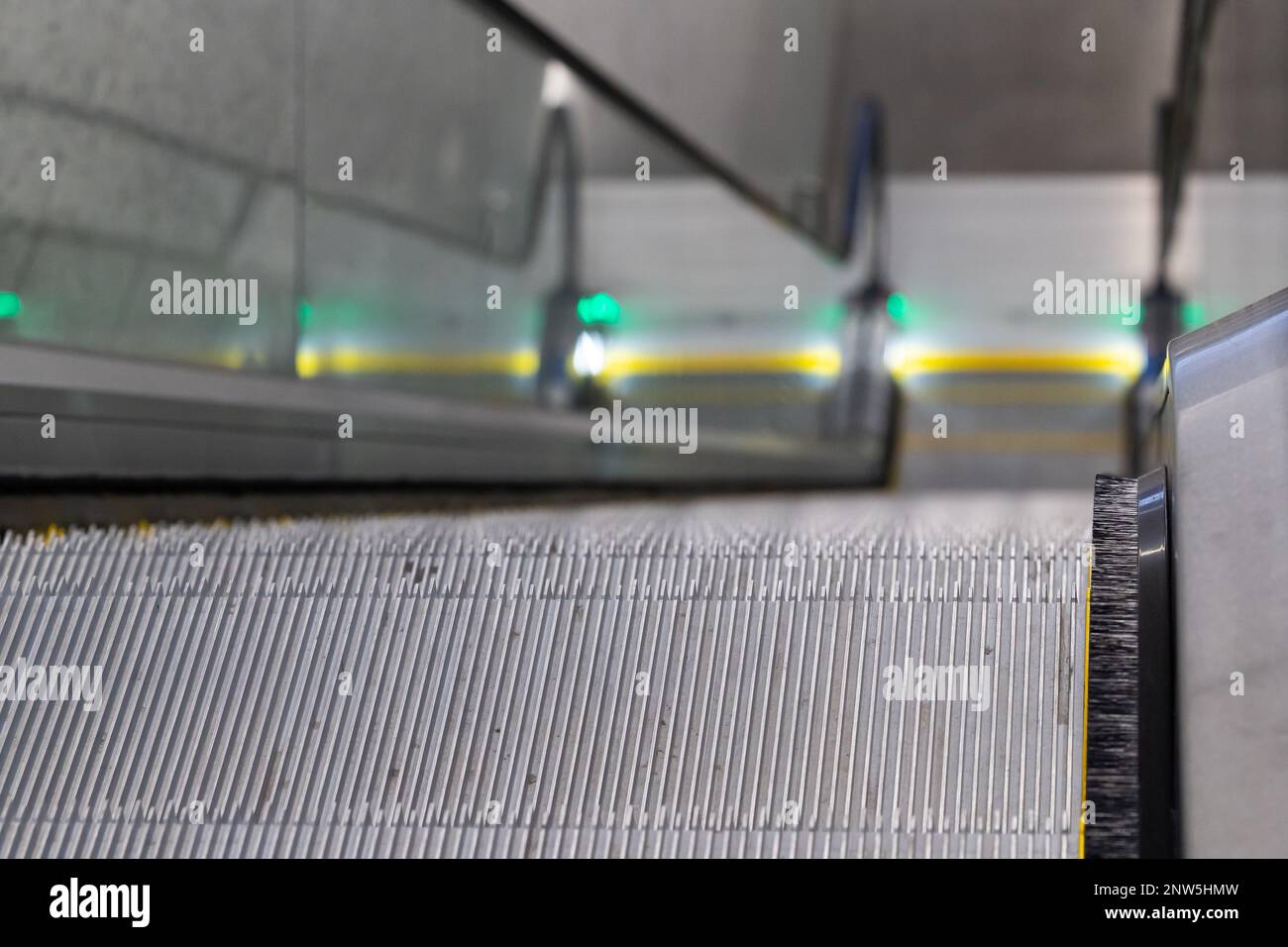 Escalators in an underground pedestrian passage. Close-up of steps ...