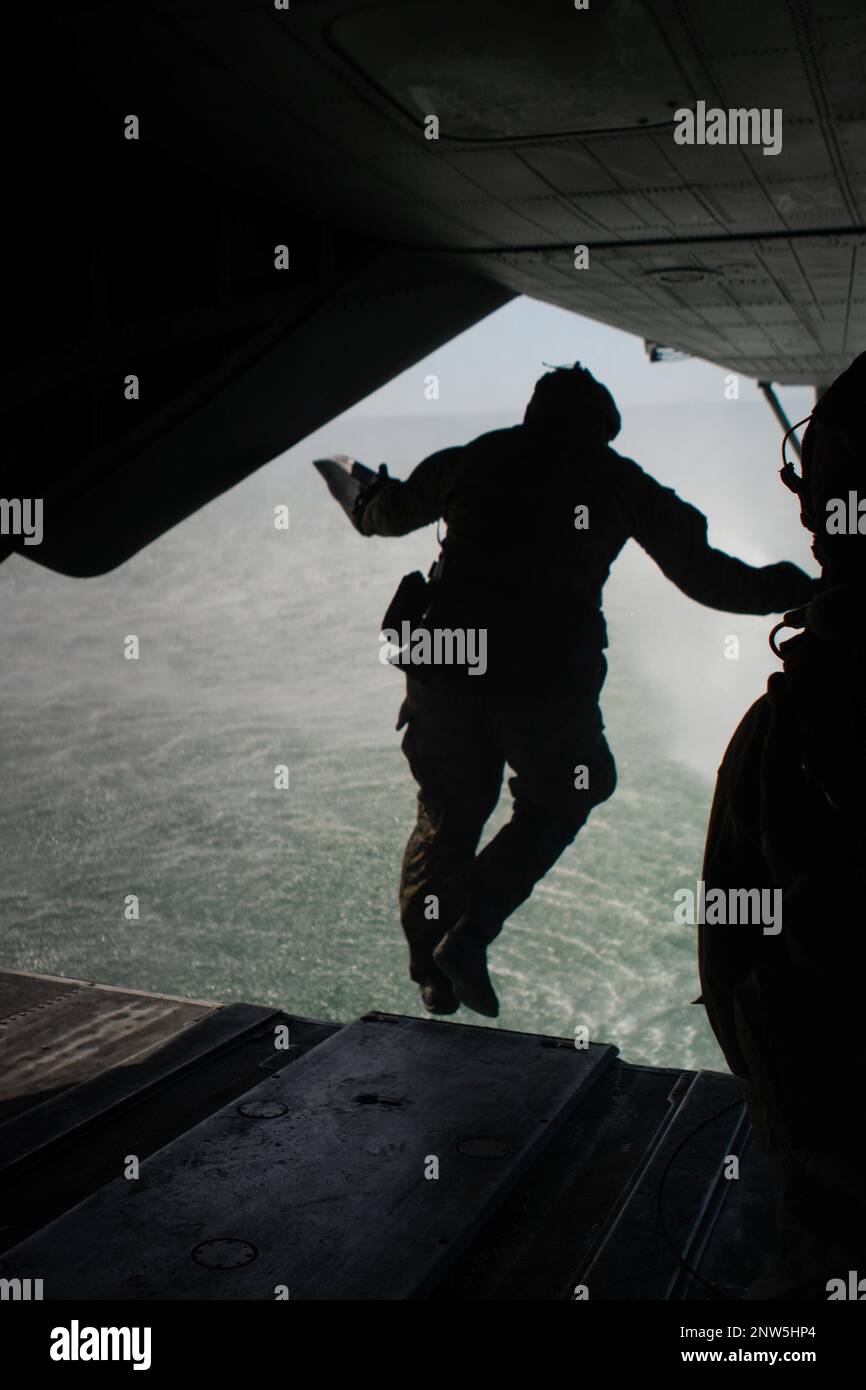 A U.S. Marine with Alpha Company, 2nd Reconnaissance Battalion, jumps ...