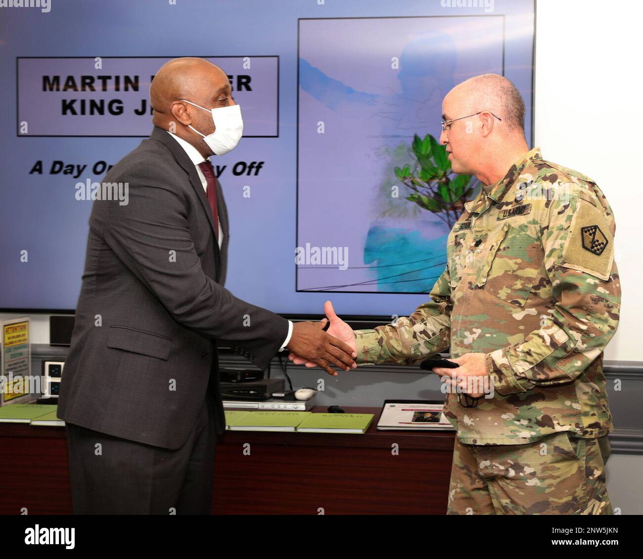 Paul T. Smaw, USAG Ft Hamilton Safety Manager receives a challenge coin ...