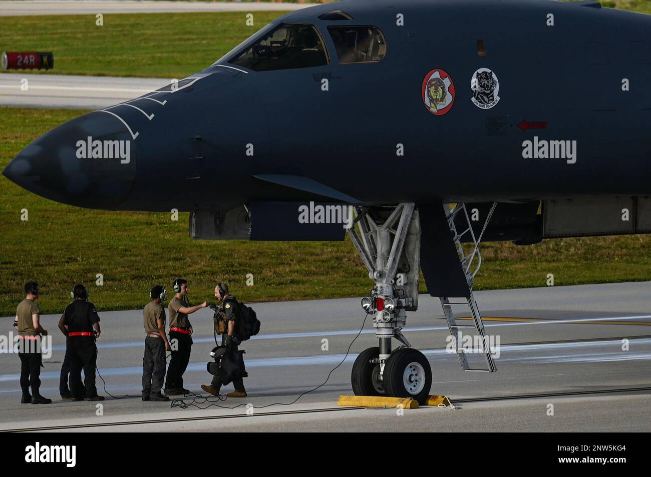 U.S. Airmen assigned to the 34th Expeditionary Bomb Squadron greet a ...