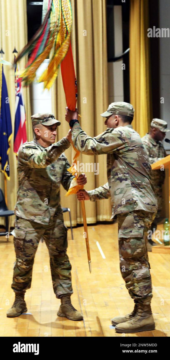 Command Sgt. Maj. Lonnie R. Null passes the 2d Theater Signal Brigade colors to Col. Ronald ...