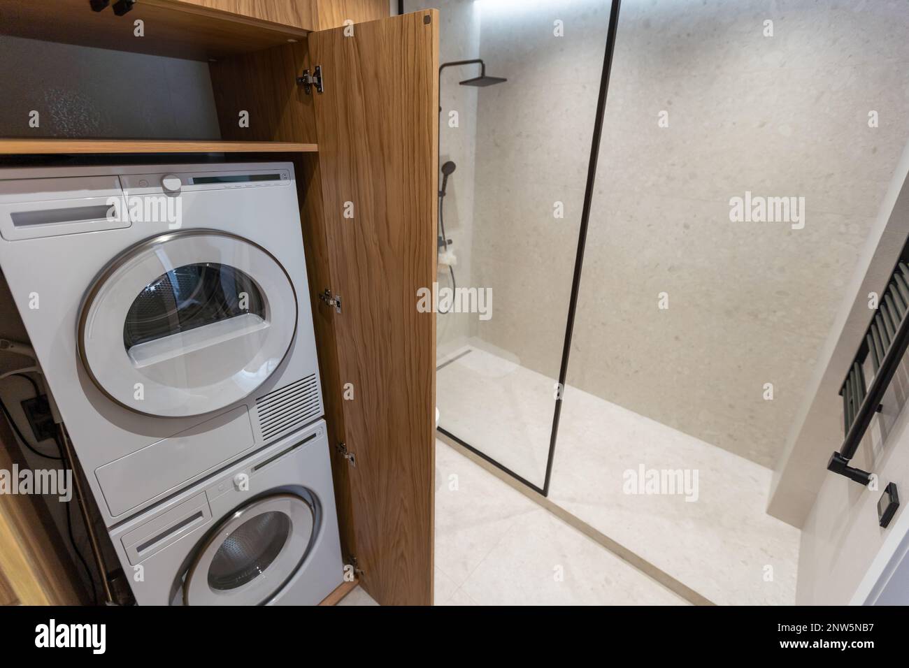 Marble laundry room interior with wooden countertops, a closet and ...