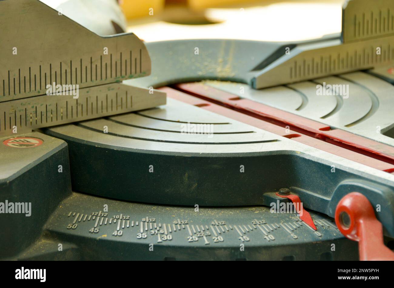 ruler of electric circular saw, cutting piece of wood. trimming saw ...