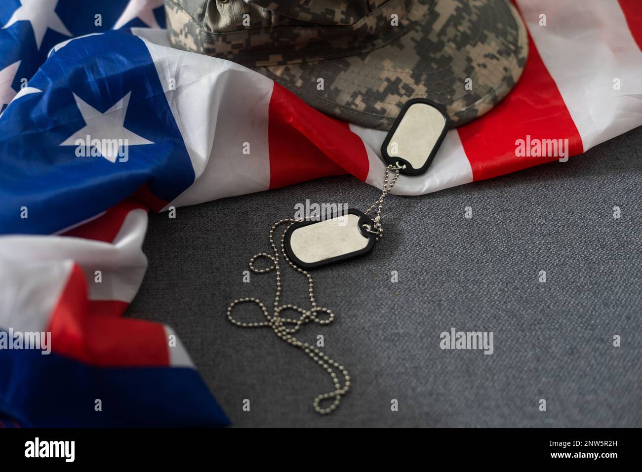 Army tokens on American national flag background Stock Photo - Alamy