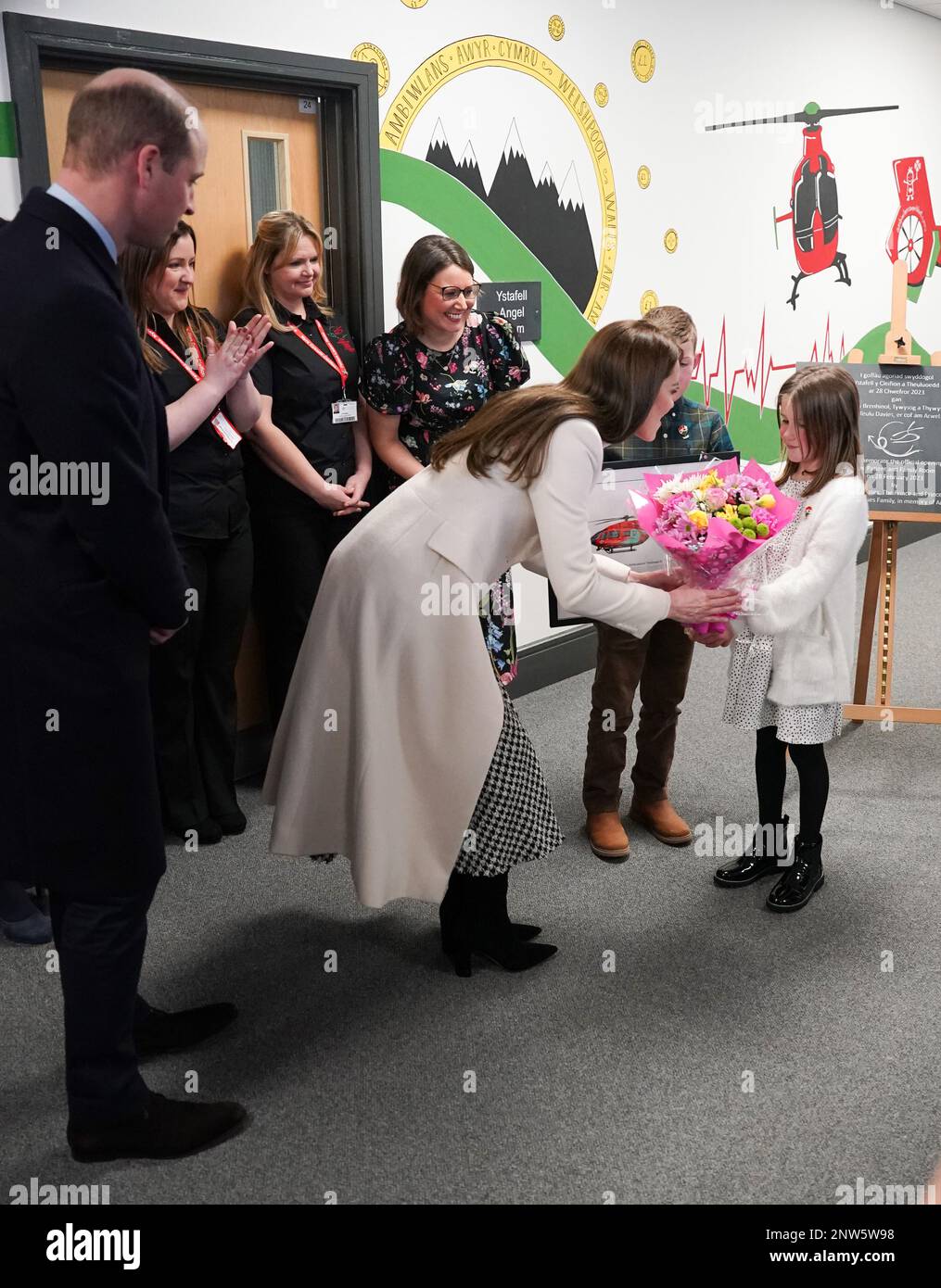 The Princess of Wales receives flowers from Sofia Davies, nine, as the ...
